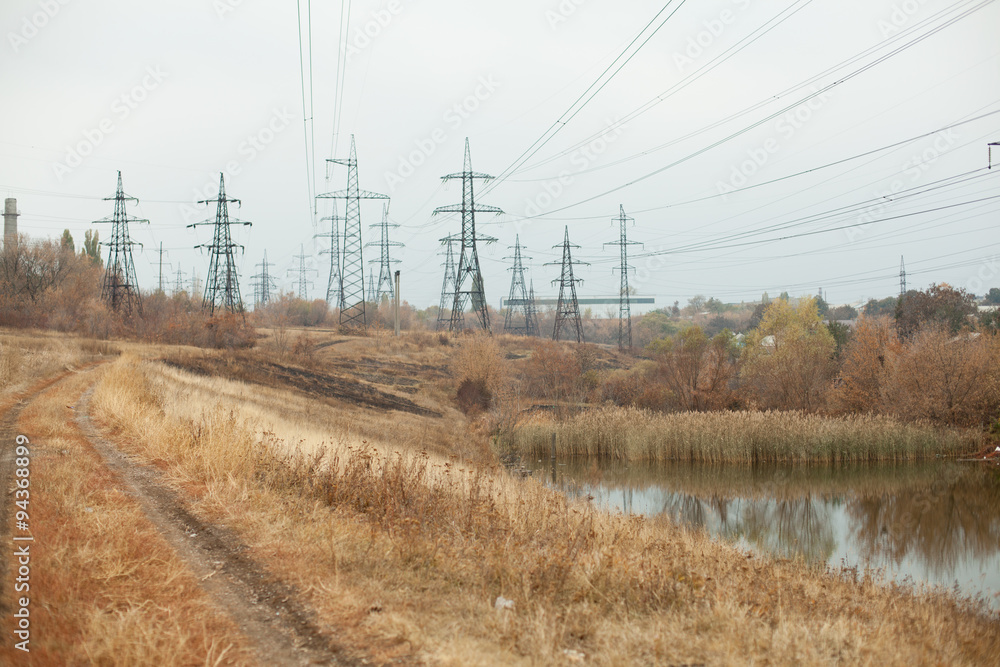 Coal power station in beautiful area full of trees and lake, mirror ...