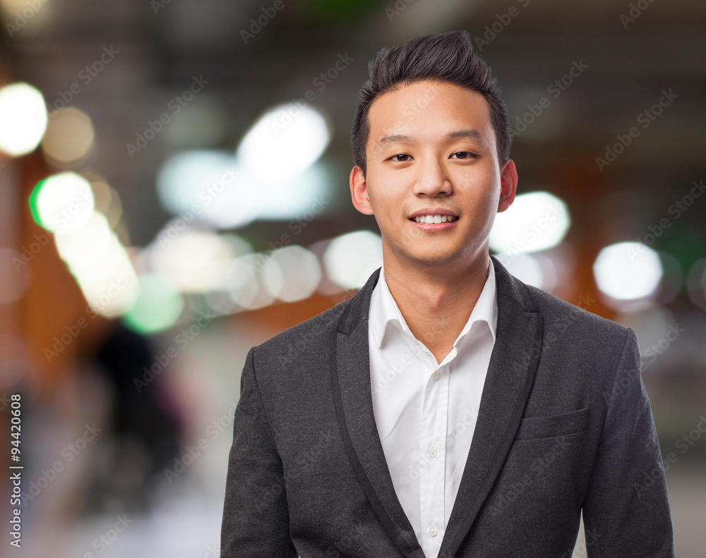 handsome young asian man standing wearing a suit Stock Photo | Adobe Stock