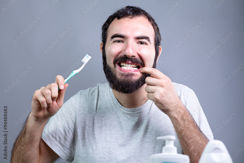 Man with Beard and Toothbrush Showing His Teeth Stock Photo | Adobe Stock