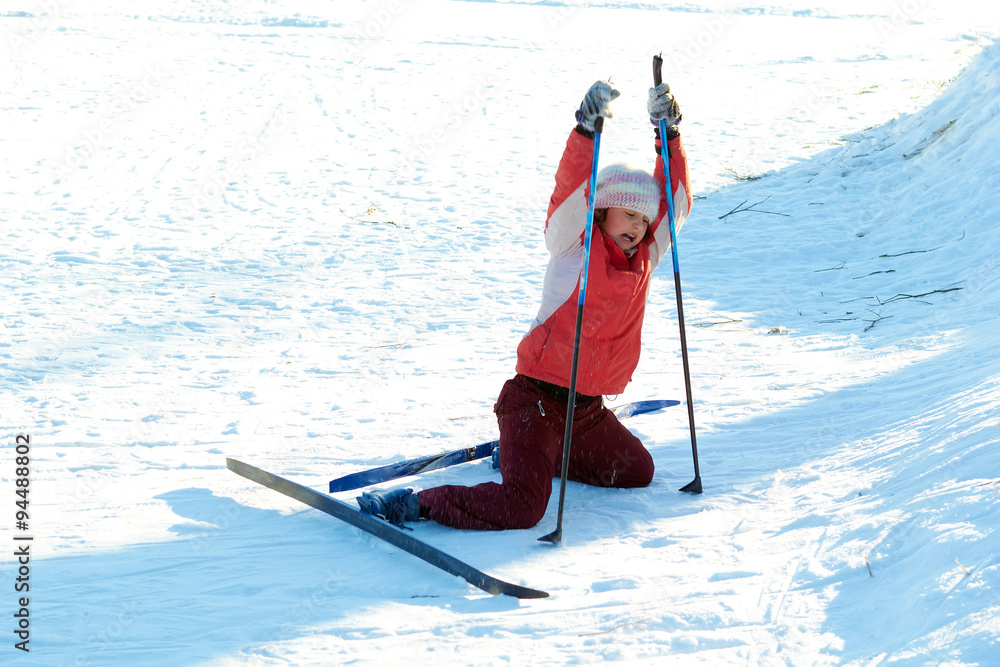 young beauty girl standing up after drop on snow while skies Stock ...
