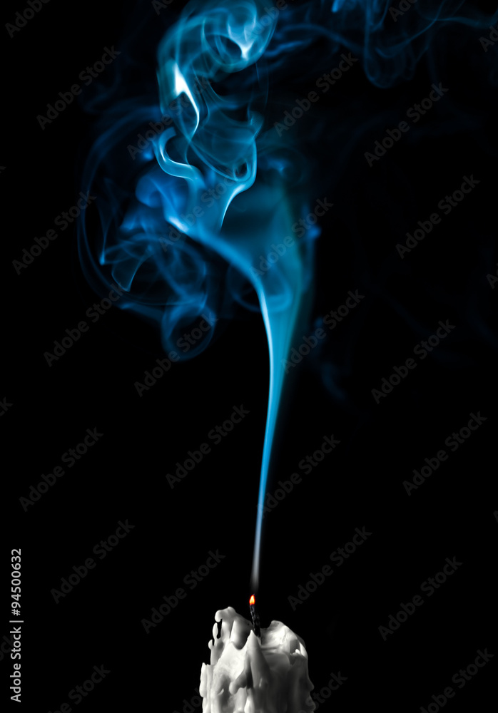 Extinguished fuming candle and smoke on a black background Stock Photo ...