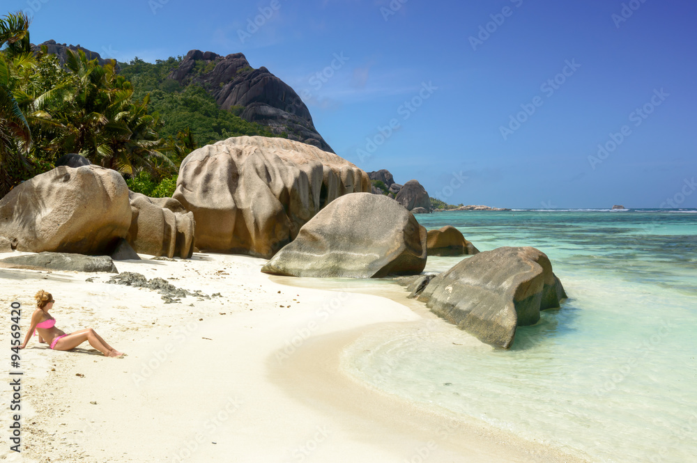 Beautiful young woman in paradise beach of Seychelles in la Digue ...