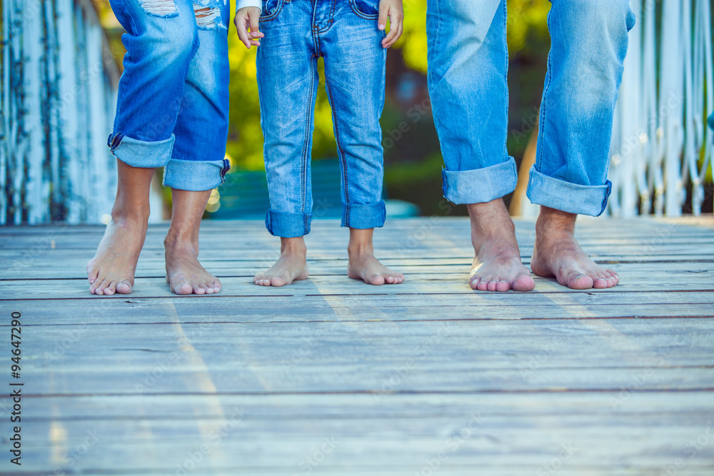 Happy Family on a Walk in Summer. Child with Parents Together. Feet ...