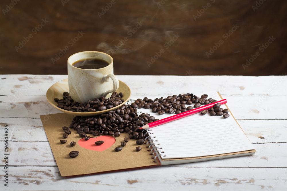 coffee cup Beans and Hart in Book on White Wooden Stock Photo | Adobe Stock