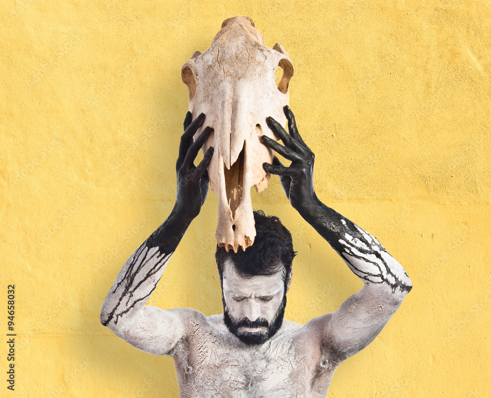 Primitive man offering horse skull Stock Photo | Adobe Stock