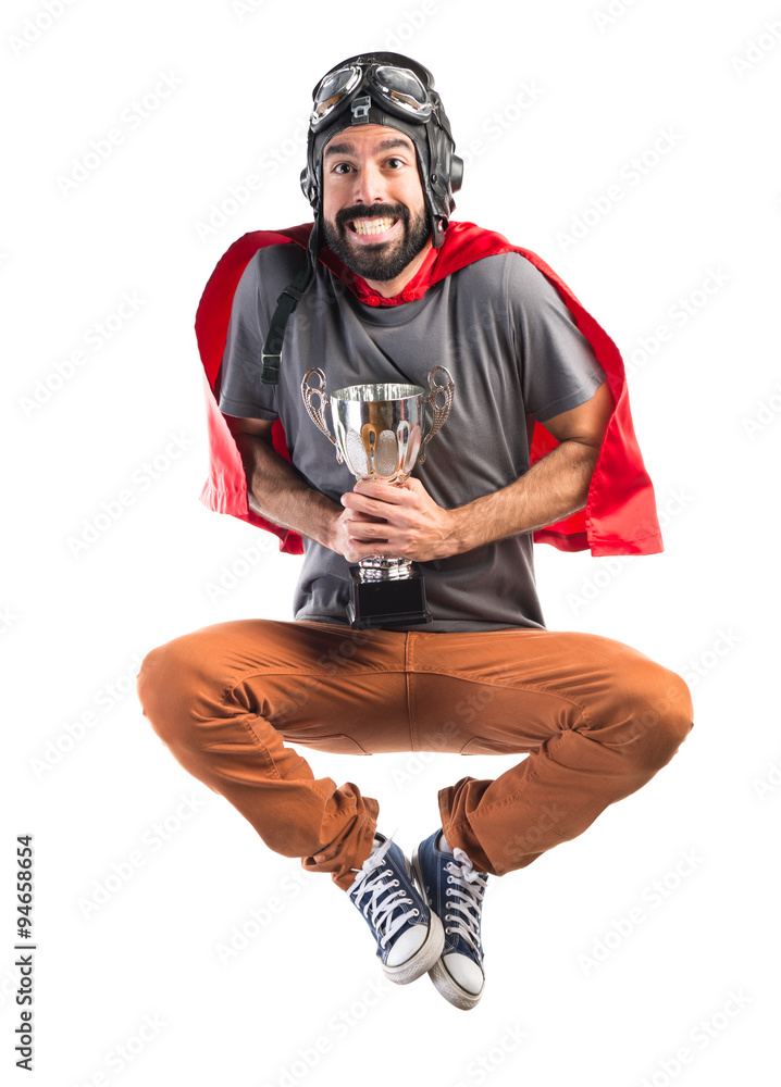 Superhero holding a trophy Stock Photo | Adobe Stock