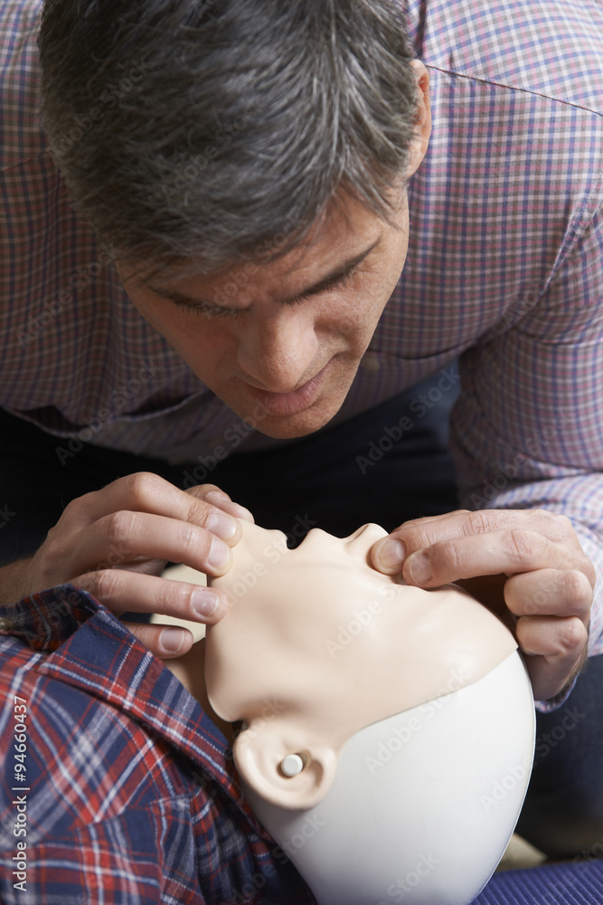 Man In First Aid Class Performing Mouth To Mouth Resuscitation O Stock ...