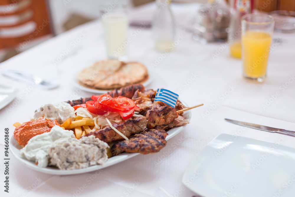 Foto de Greek menu with four types of grilled meat do Stock | Adobe Stock