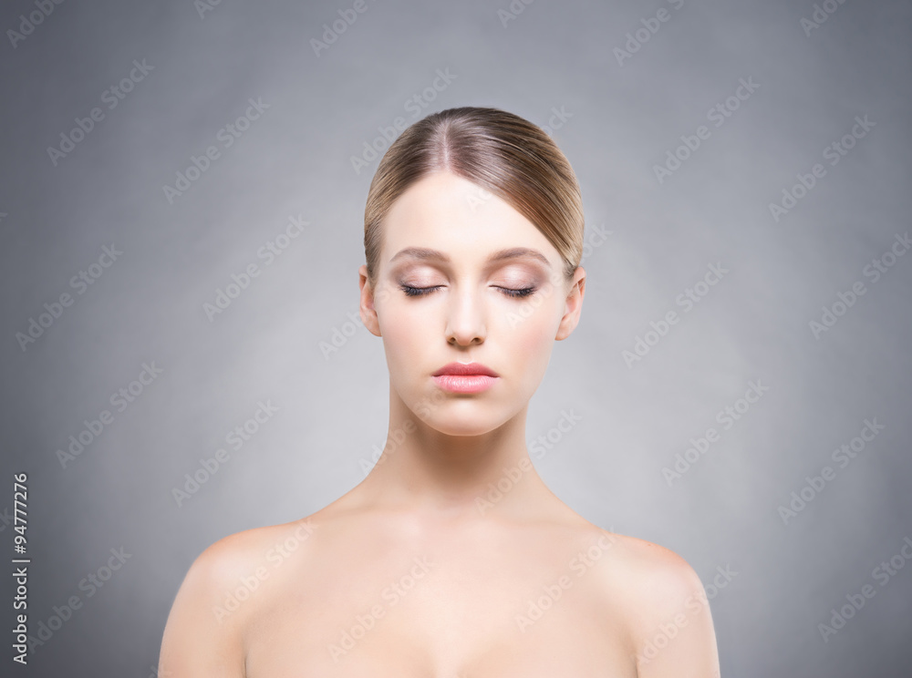 Attractive girl with smooth skin over the grey background. Stock Photo ...