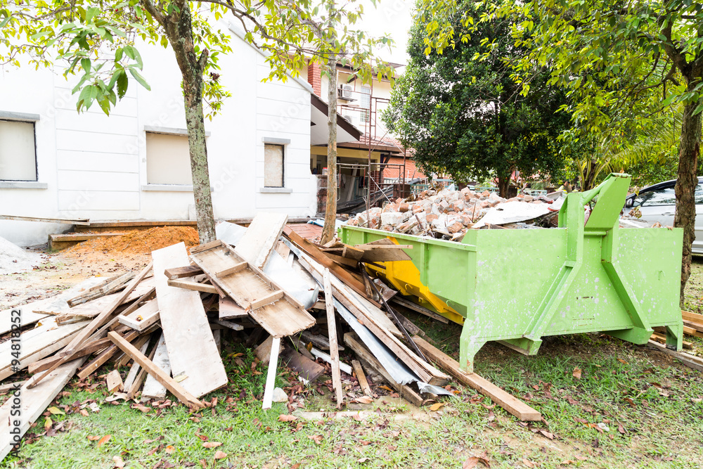 Construction rubbish bin with loads at construction site. Stock Photo ...