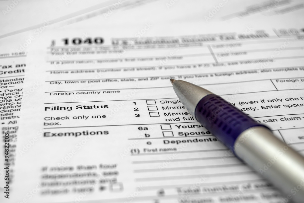 Tax form with pen Stock Photo | Adobe Stock