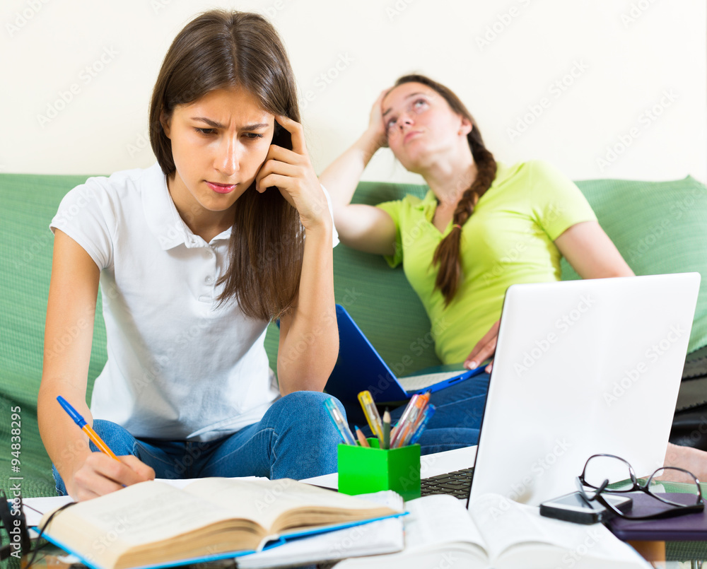 Sad students studying at home Stock Photo | Adobe Stock