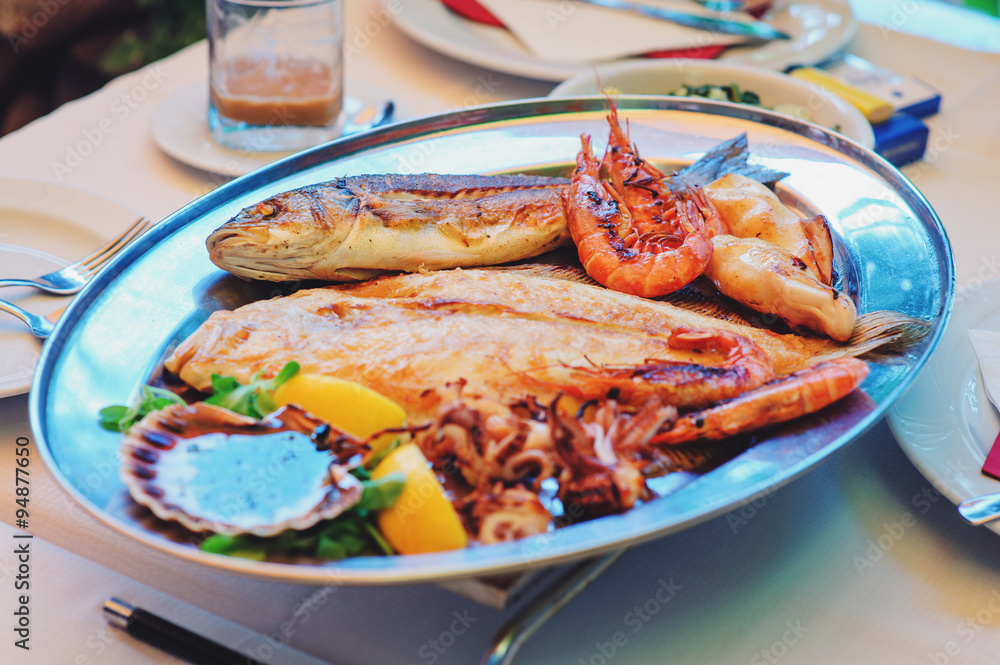 traditional slovenian food, fish plate with seafood, selective focus ...