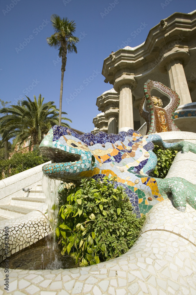 A colored mosaic dragon fountain with colored ceramic tile stands guard ...