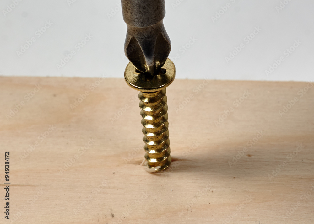 Foto Stock tightening the screws | Adobe Stock