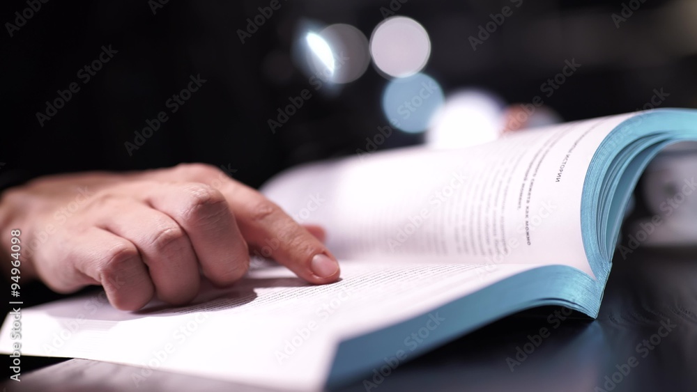 Close up on fenale's finger pointing on text in a book. Stock Video ...