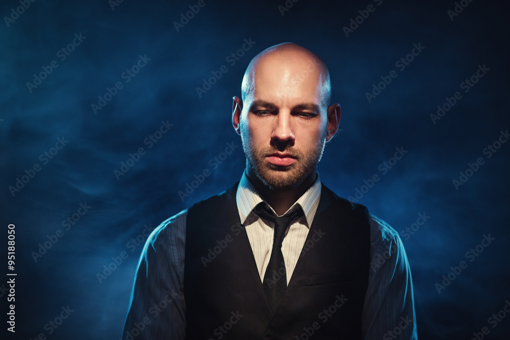 bald man on a dark background Stock Photo | Adobe Stock
