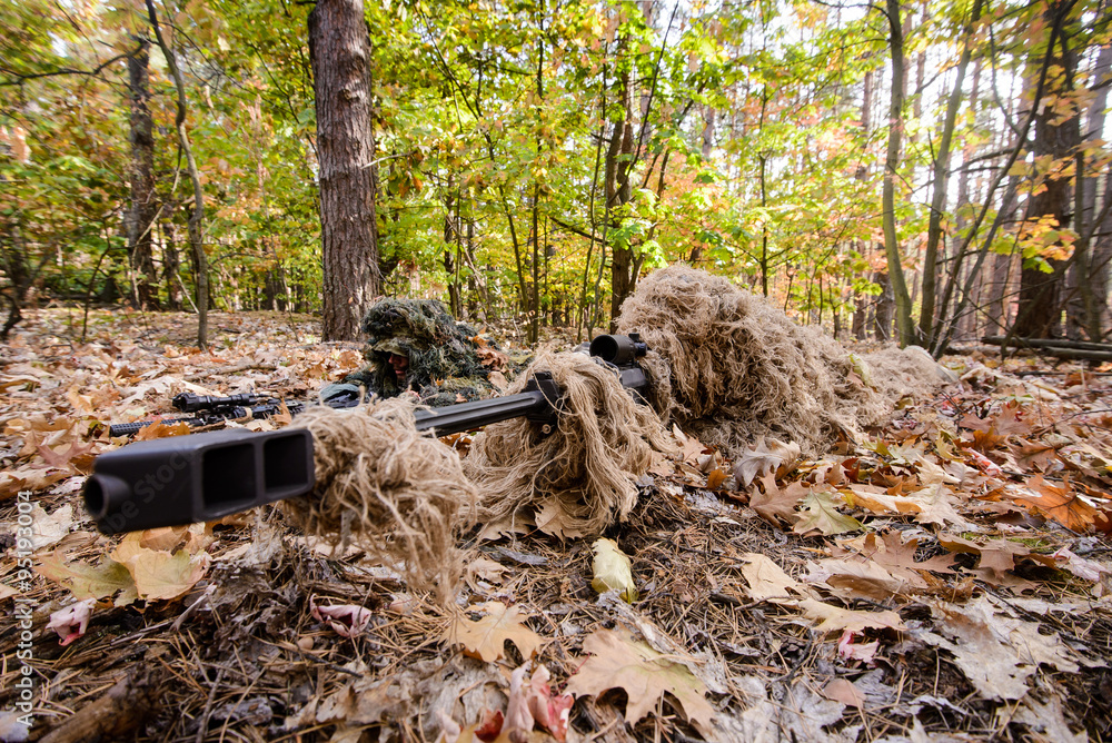 Sniper with huge rifle in forest/Team of two masked soldiers with ...
