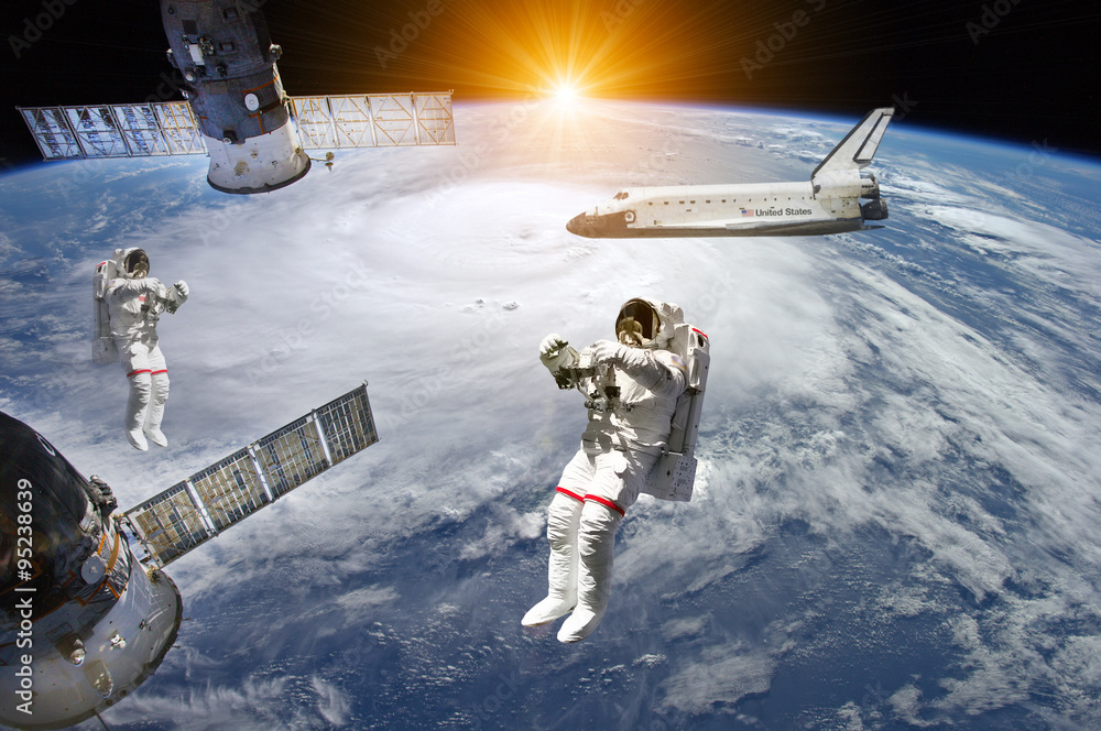 Astronauts, Space Station and Shuttle in outer space - Elements of this ...