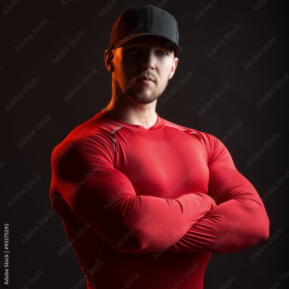 Muscular man in red Stock Photo | Adobe Stock