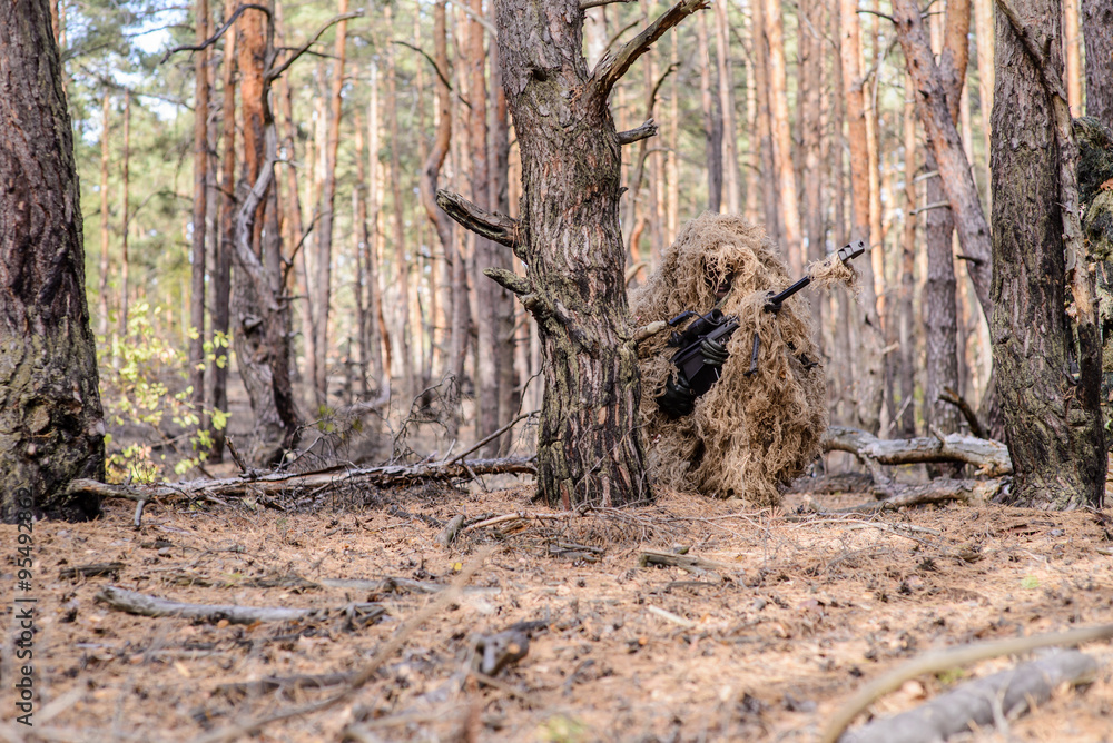 Sniper hiding in forest/Soldier dressed as sniper hide in woods with ...