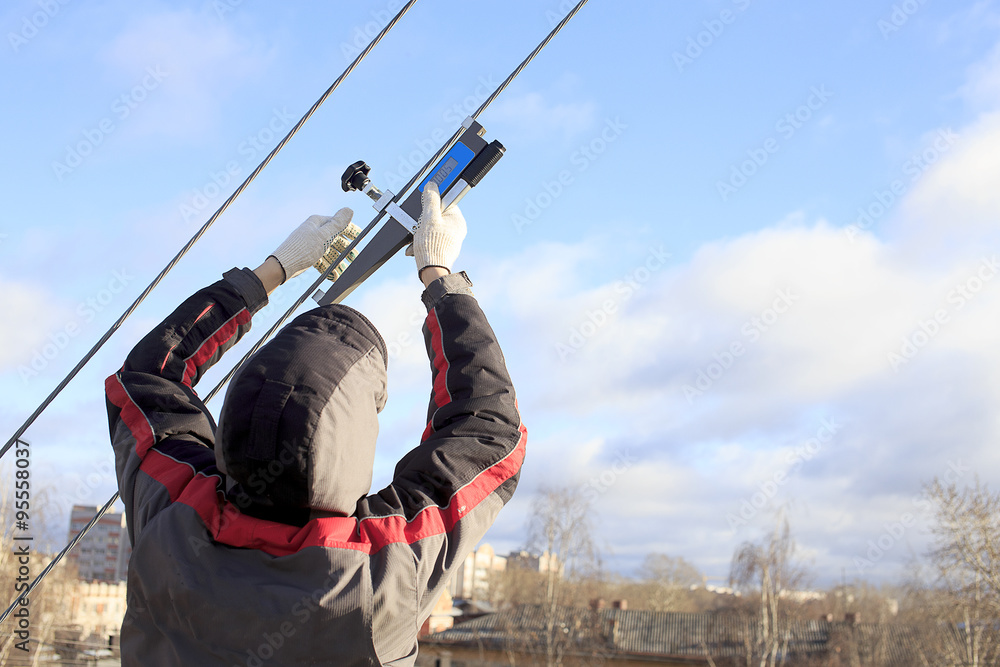 measurement of cable tension. engineer measures the tension of the ...