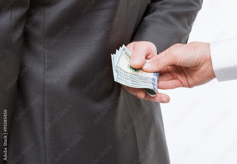 Female hand giving a bribe to businessman Stock Photo | Adobe Stock
