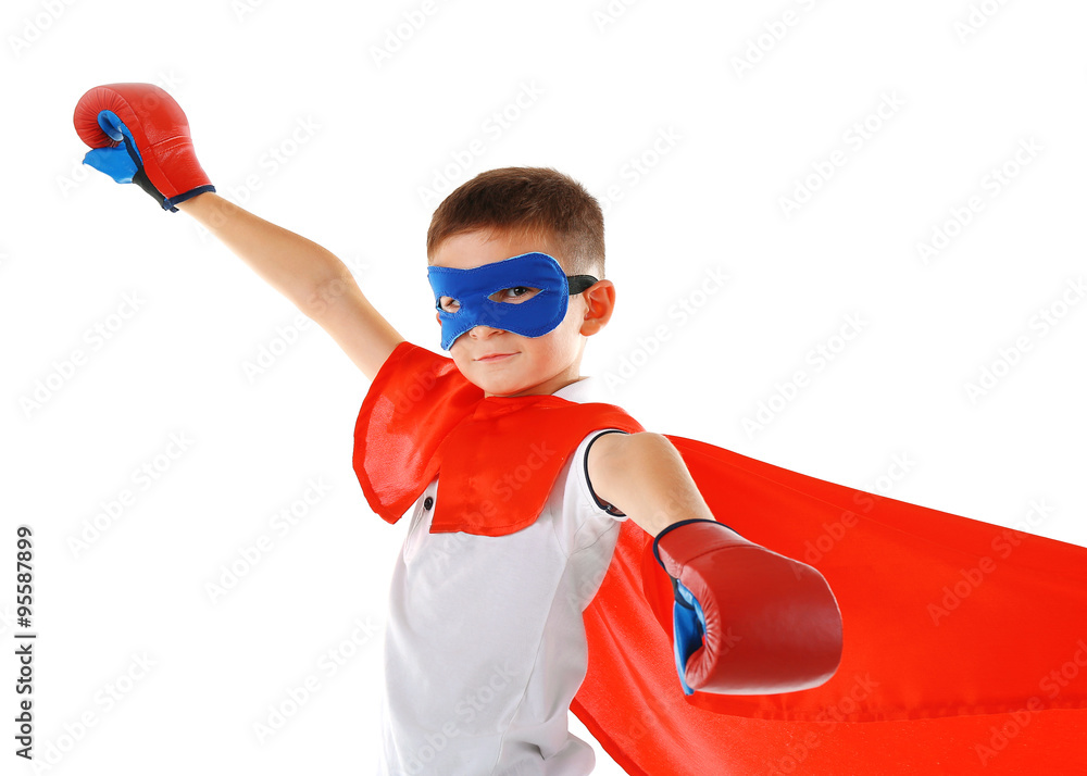 Boy dressed as superhero with boxing gloves poses in studio isolated on ...