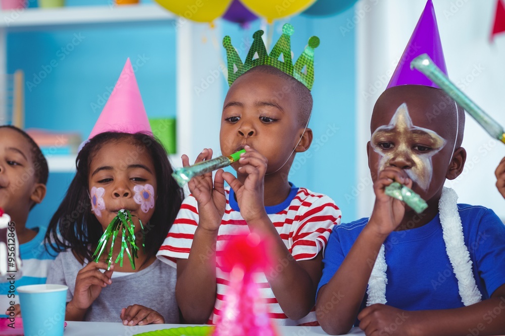 Happy kids celebrating a birthday Stock Photo | Adobe Stock
