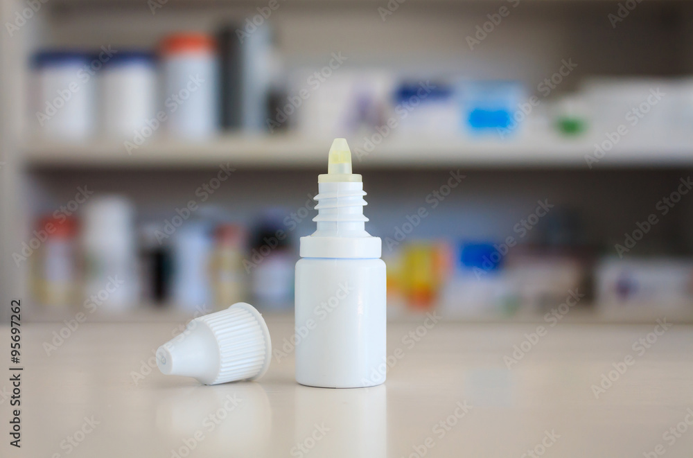eye ear drops medicine bottle with pharmacy store shelves backgr Stock ...