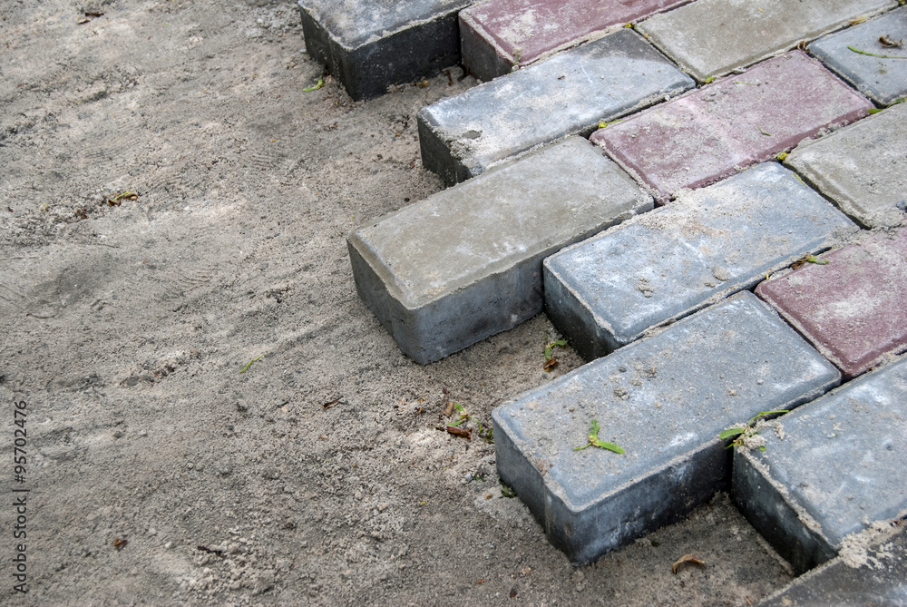 Installing paver bricks for the sidewalk pavement Stock Photo | Adobe Stock