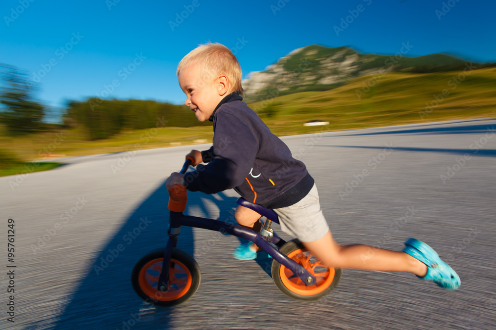Boy on a bicycle. Stock Photo | Adobe Stock