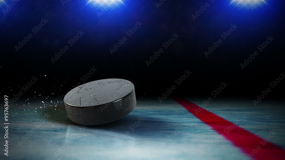 Hockey Puck Spin Across Ice. a close up shot of a hockey puck spinning ...