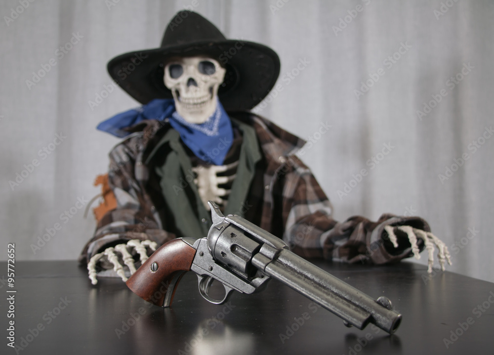 Old West Revolver Skeleton. Old west bandit outlaw skeleton at a poker ...