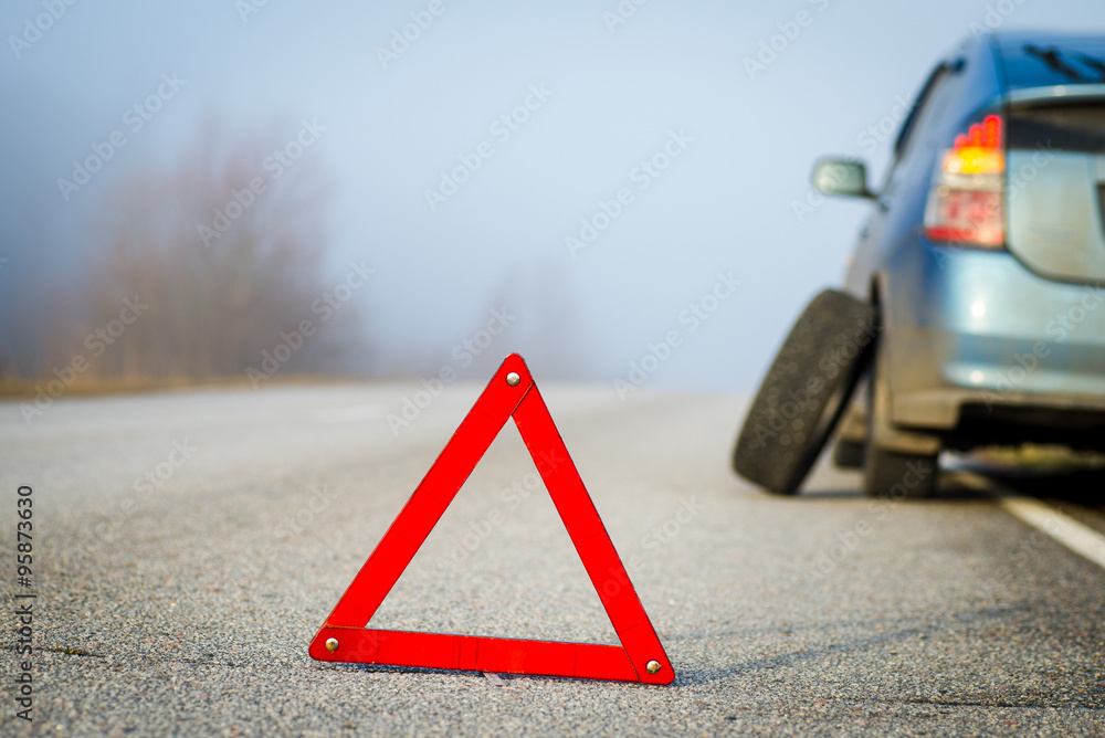 Emergency stop sign in background with broken blue car Stock Photo ...