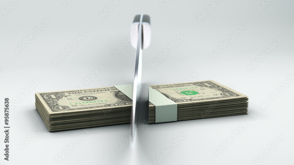 Stack of Money Cut with Knife. stack of money rotates and is cut in ...