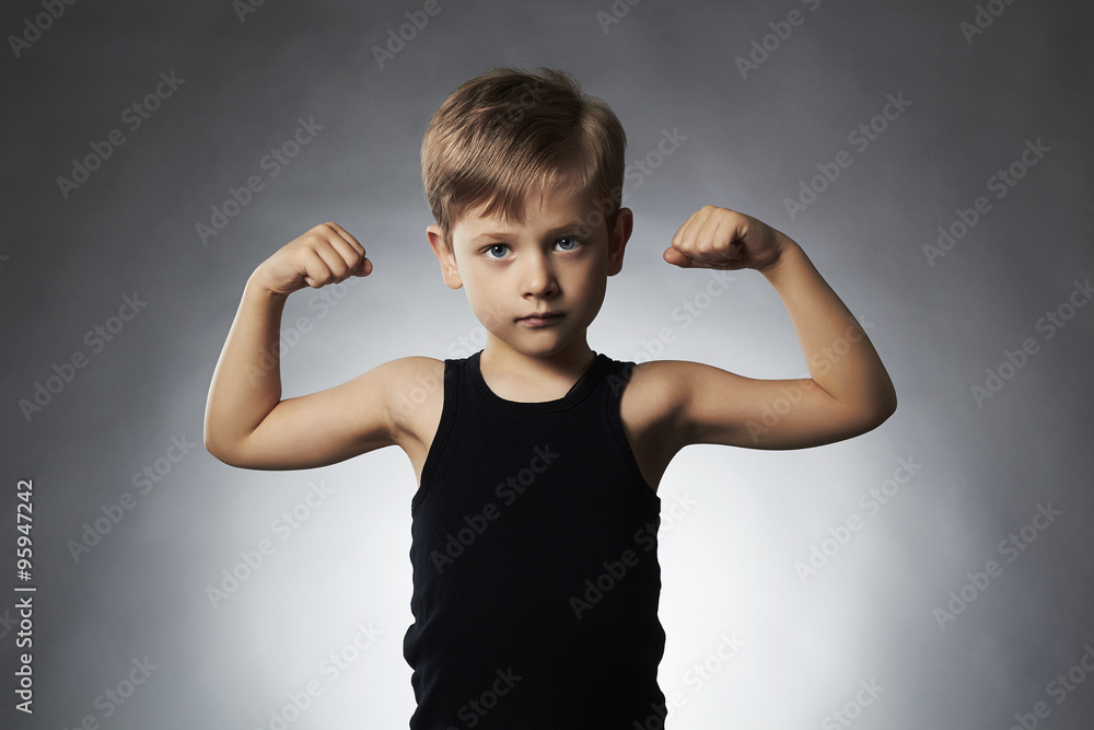 Child.Funny sport Little Boy showing his hand biceps muscles Stock ...