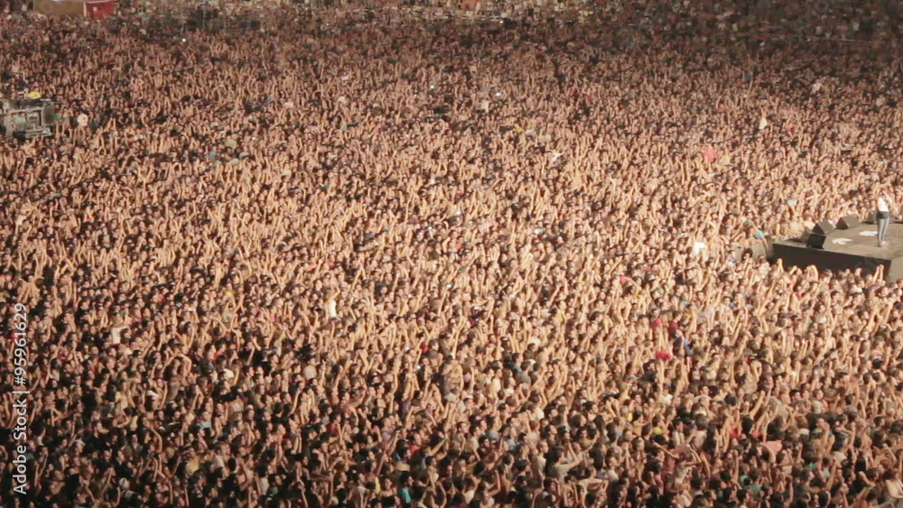 huge crowd,fans,full arena ,concert,cheering applauding hands in air ...