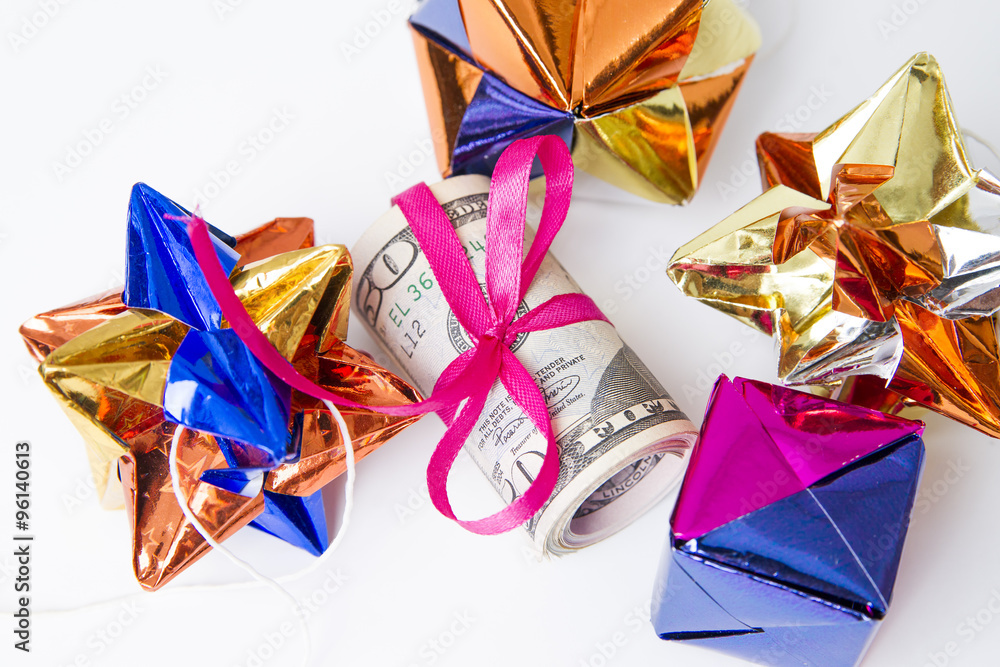 Money with red ribbon on a white background Stock Photo | Adobe Stock