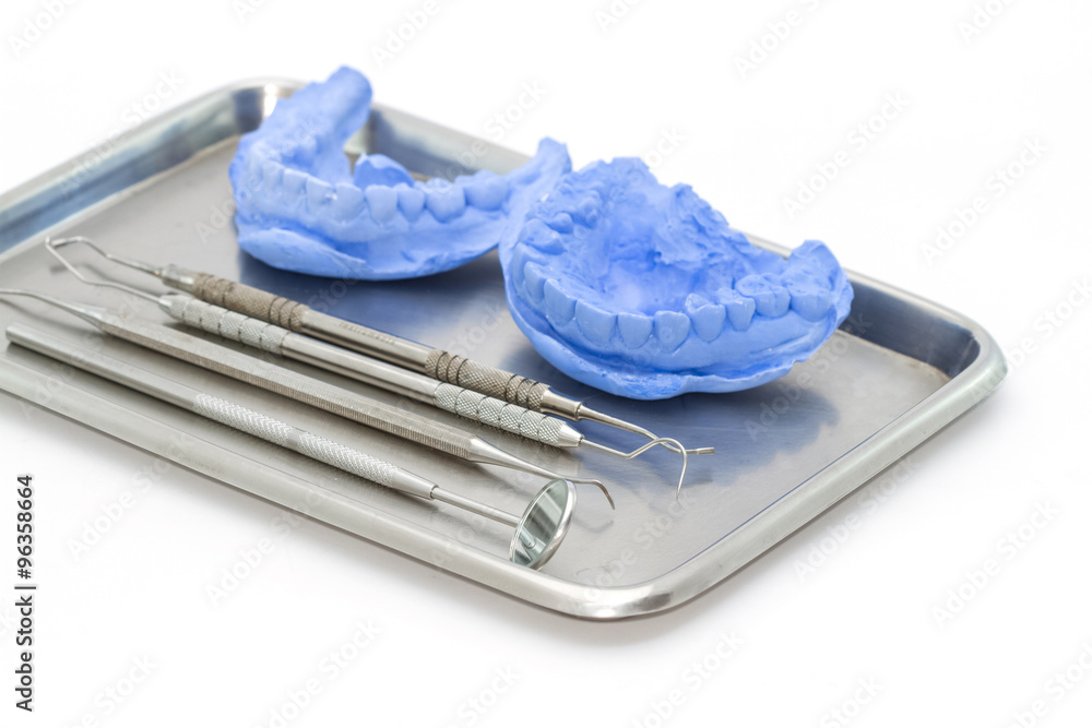 Blue dental mold of teeth with dental tool on sterile tray Stock Photo ...