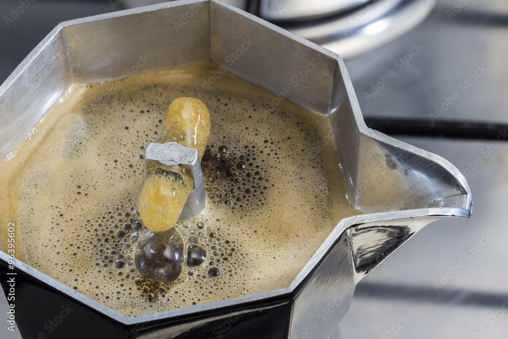 making the coffee in italian moka - close up italian mocha making ...