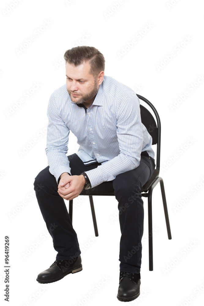 man sitting on chair. Isolated white background. makes decisions ...