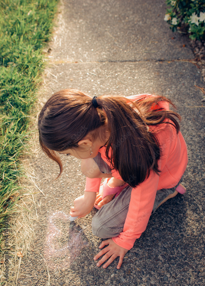 Young girl playing outdoors. Stock Photo | Adobe Stock