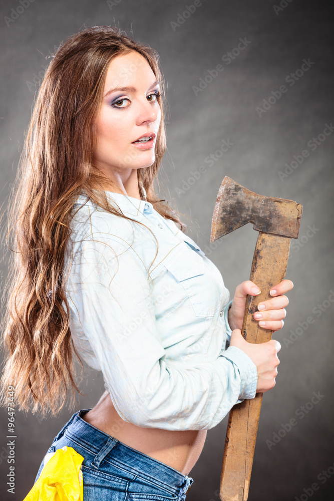 Sexy strong woman feminist with axe working. Stock Photo | Adobe Stock