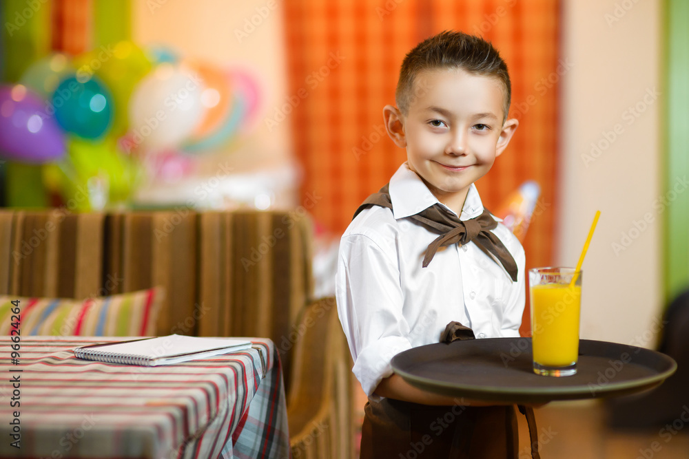 Happy cute little boy smiling waiter holding a tray width juice Stock ...