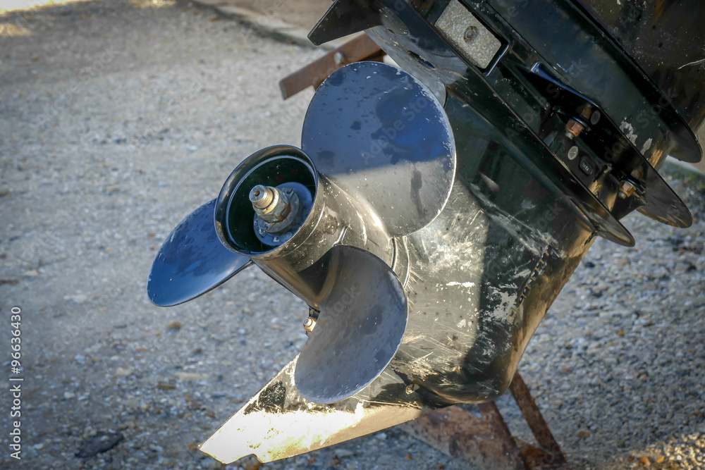 Close up of an outboard engine propeller. Outboard motor is a ...