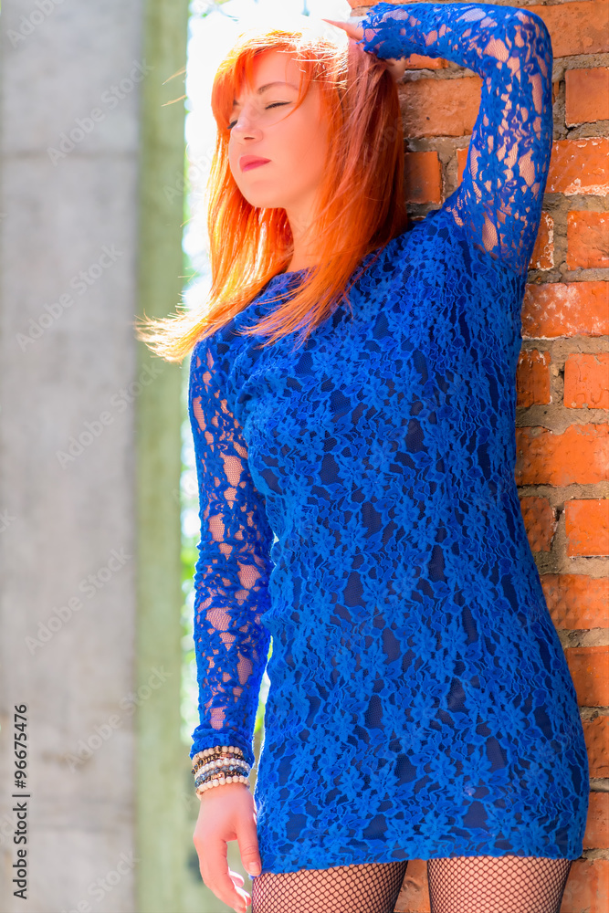 female 30 years, in a lace dress posing near the wall Stock Photo ...
