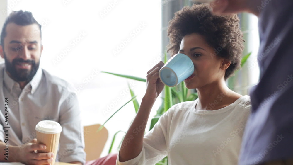 happy creative team drinking coffee in office Stock Video | Adobe Stock