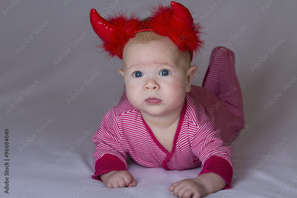 little baby with devil horns on a white background Stock Photo | Adobe ...