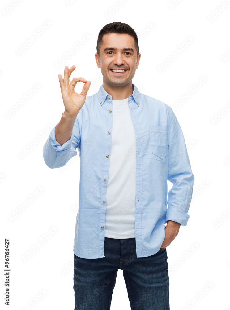 smiling man showing ok hand sign Stock Photo | Adobe Stock